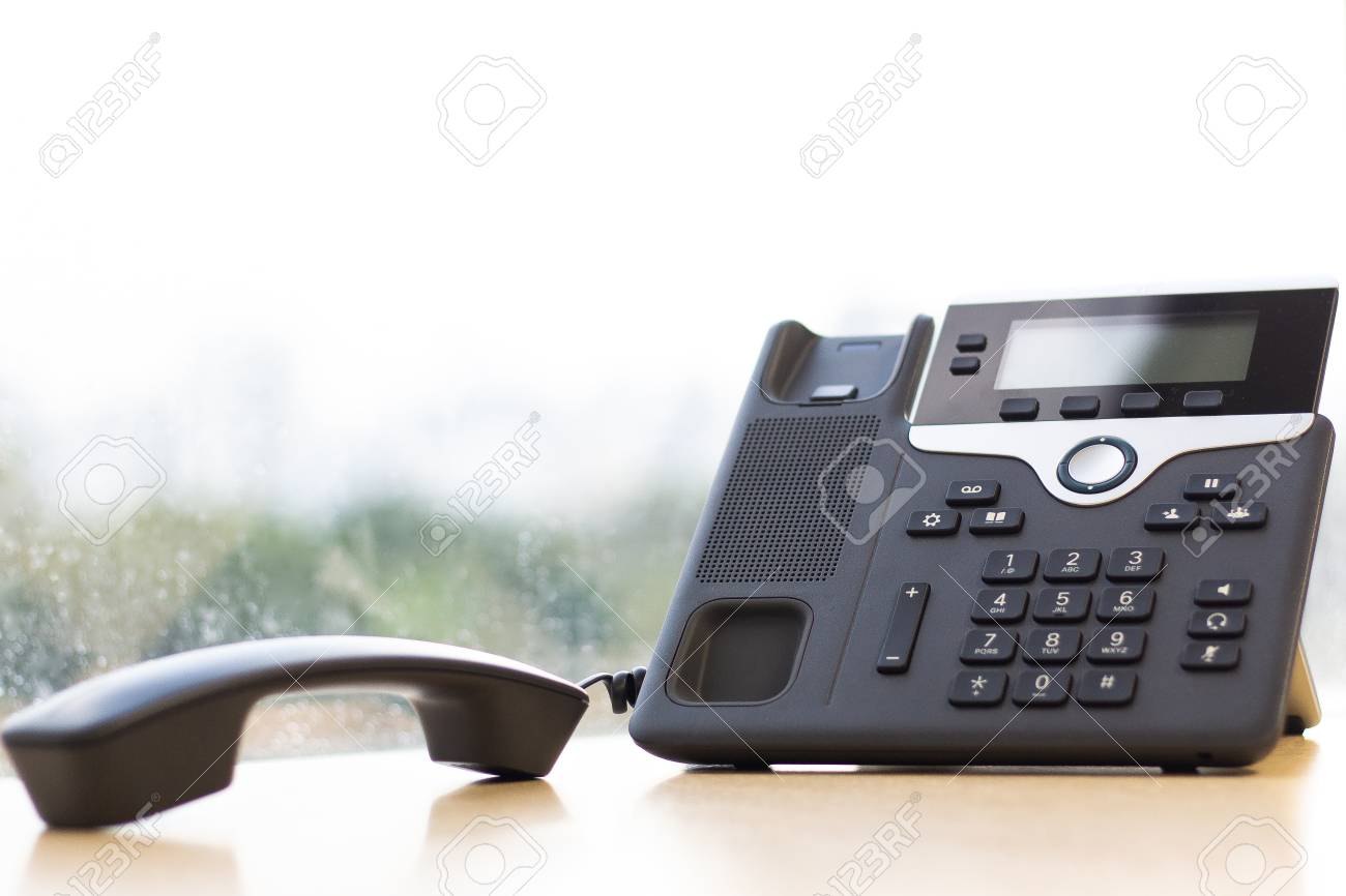 Black IP Phone On Wooden Table Telephone On Desk With Big Window City View.Modern Office Concept. Stock Photo Picture and Royalty Free Image. Image 109148430