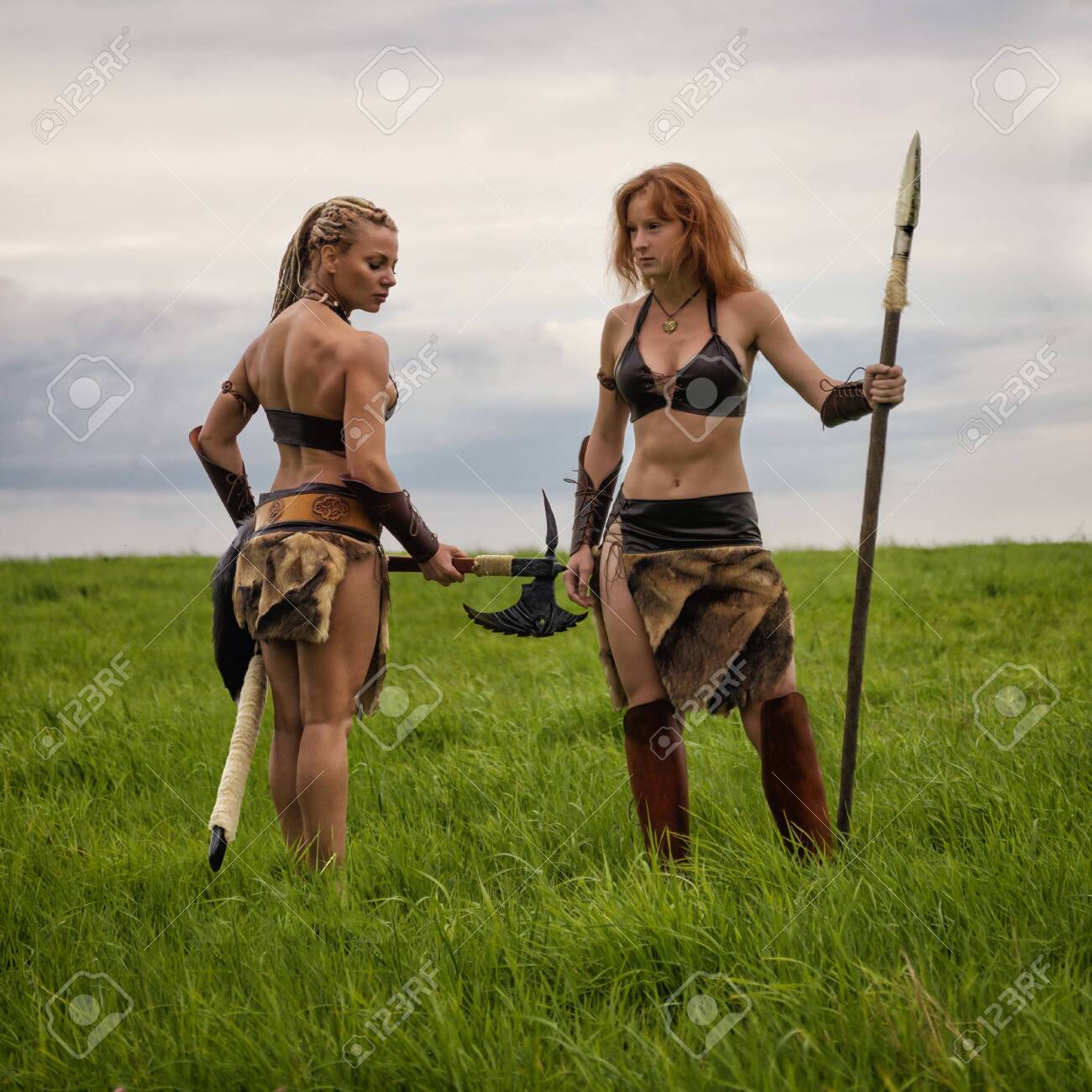 Beautiful Athletic Woman And Girl In The Image Of An Ancient Barbarian Warrior On Summer Nature Background. Stock Photo Picture and Royalty Free Image. Image 149472739