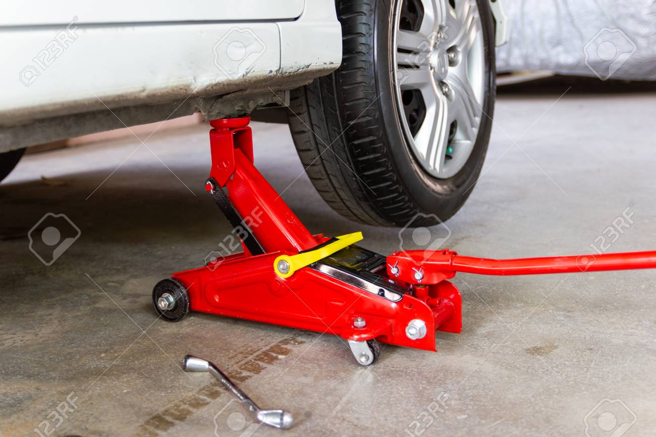 Red Tool Jack Lift Car For Repair Check Maintenance Of Cars Image 119515261