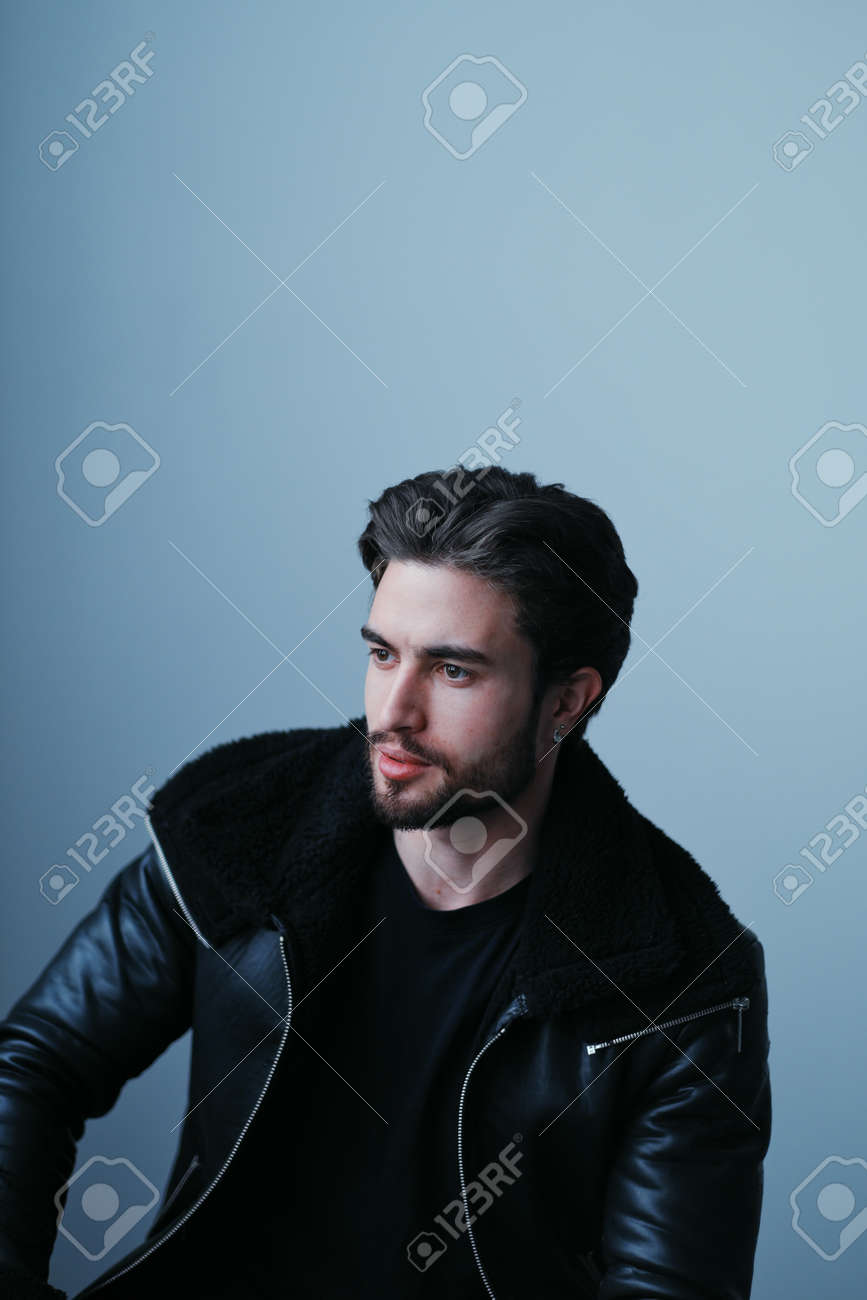 A Large Portrait Of A Stylish Young Man With A Beard And Dark Hair In A ...