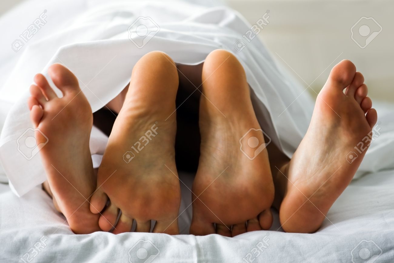 Two Pair Legs In Bed Stock Photo Picture and Royalty Free Image. Image 16140280